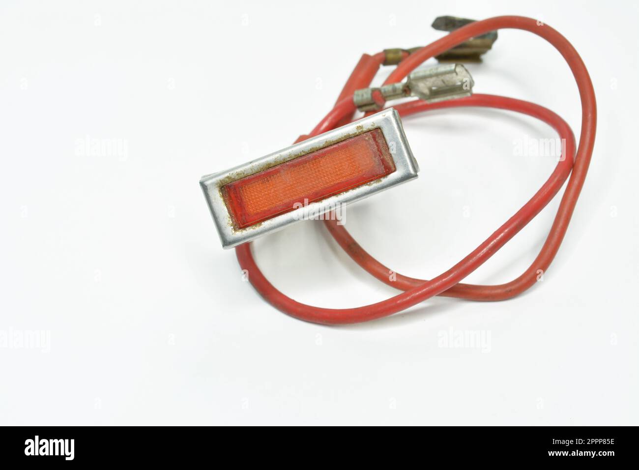 Small red light bulb with red electric cable Stock Photo - Alamy