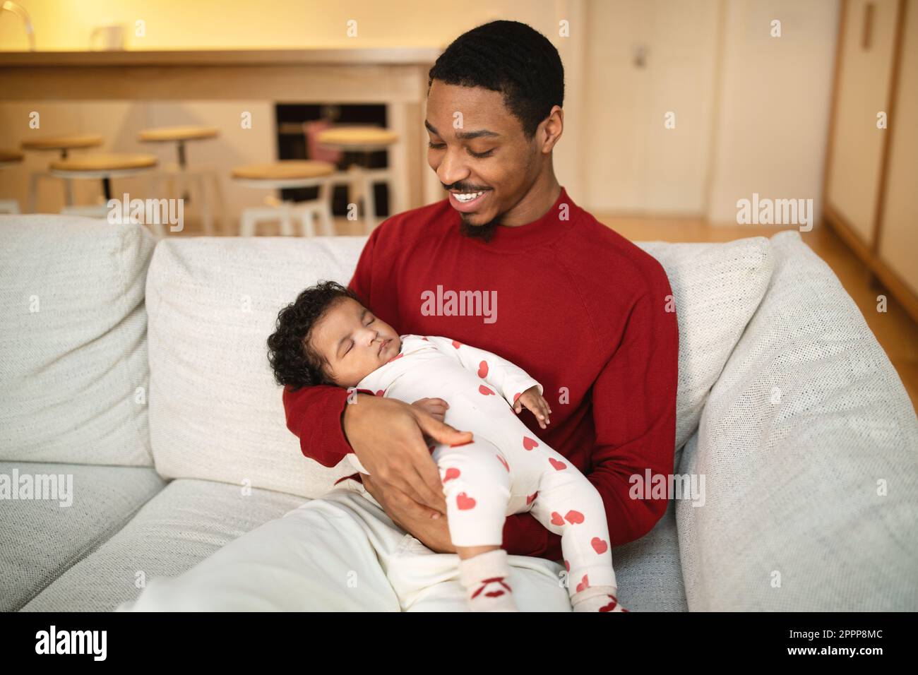 Handsome black man father holding his sleeping child cute baby Stock ...