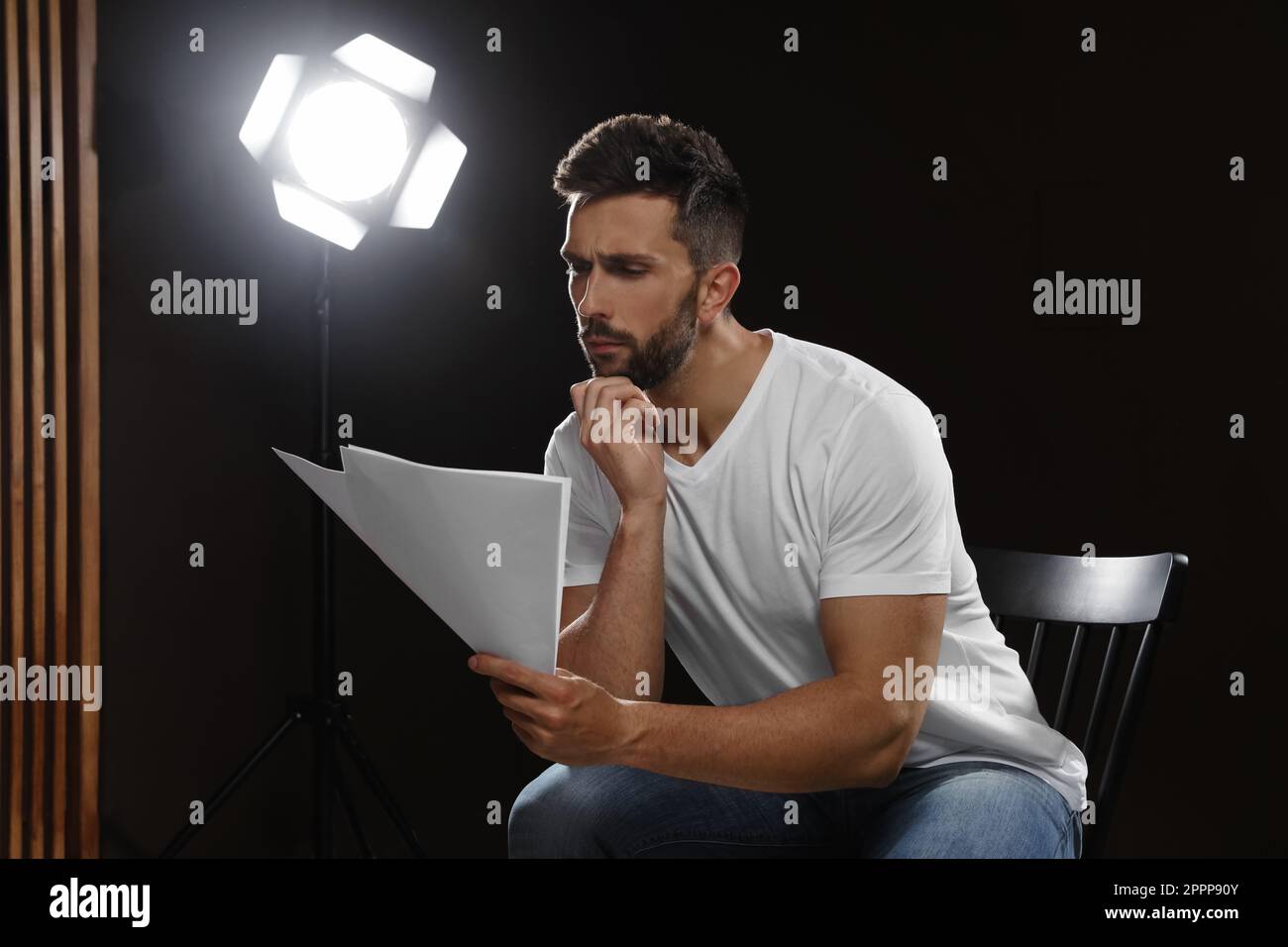 Professional actor reading his script during rehearsal in theatre Stock ...