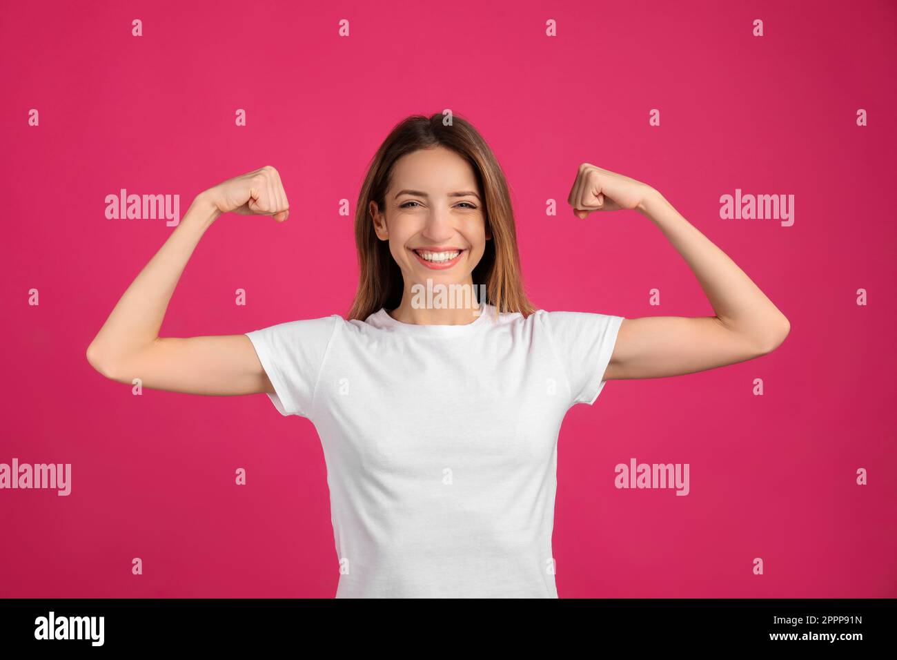 Strong woman as symbol of girl power on pink background. 8 March ...