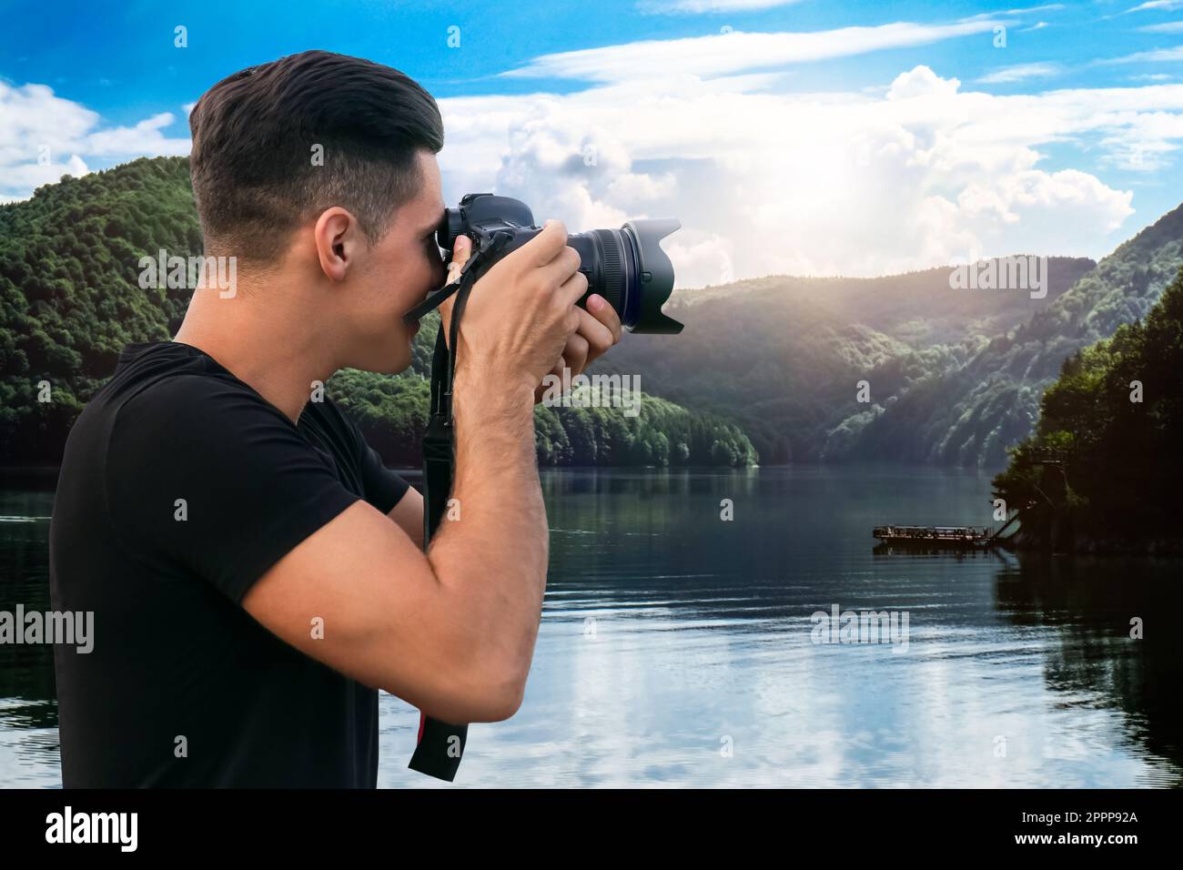 Photographer taking picture of beautiful mountains and riverside with ...