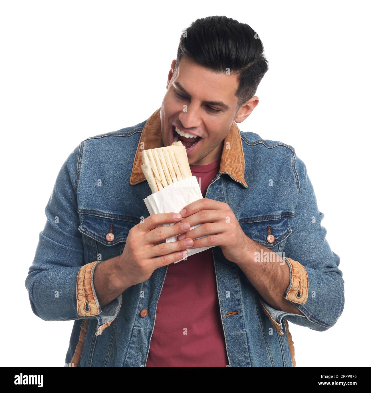 Man eating delicious shawarma on white background Stock Photo - Alamy