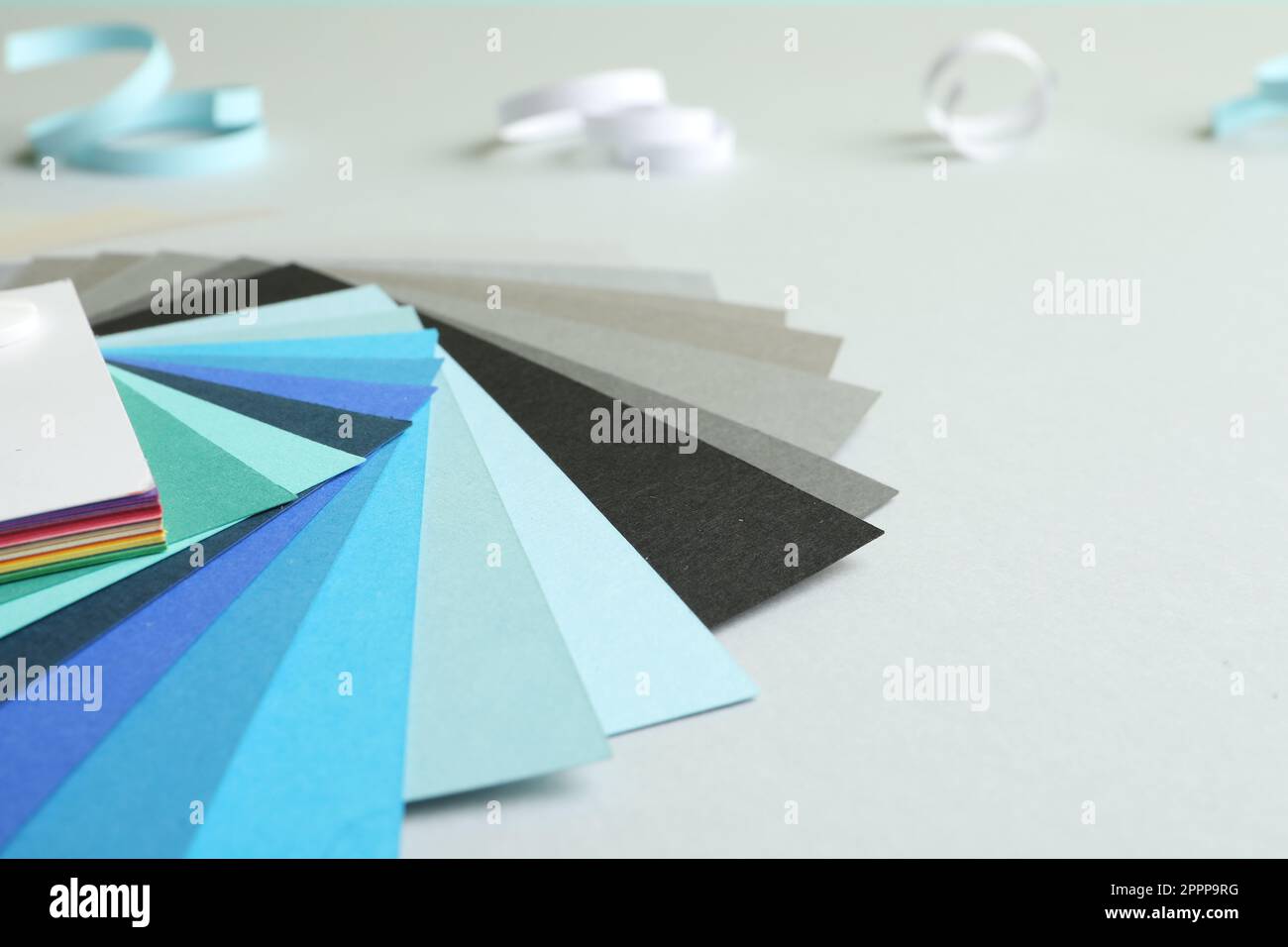 Color palette and paper curls on white background, closeup Stock Photo ...