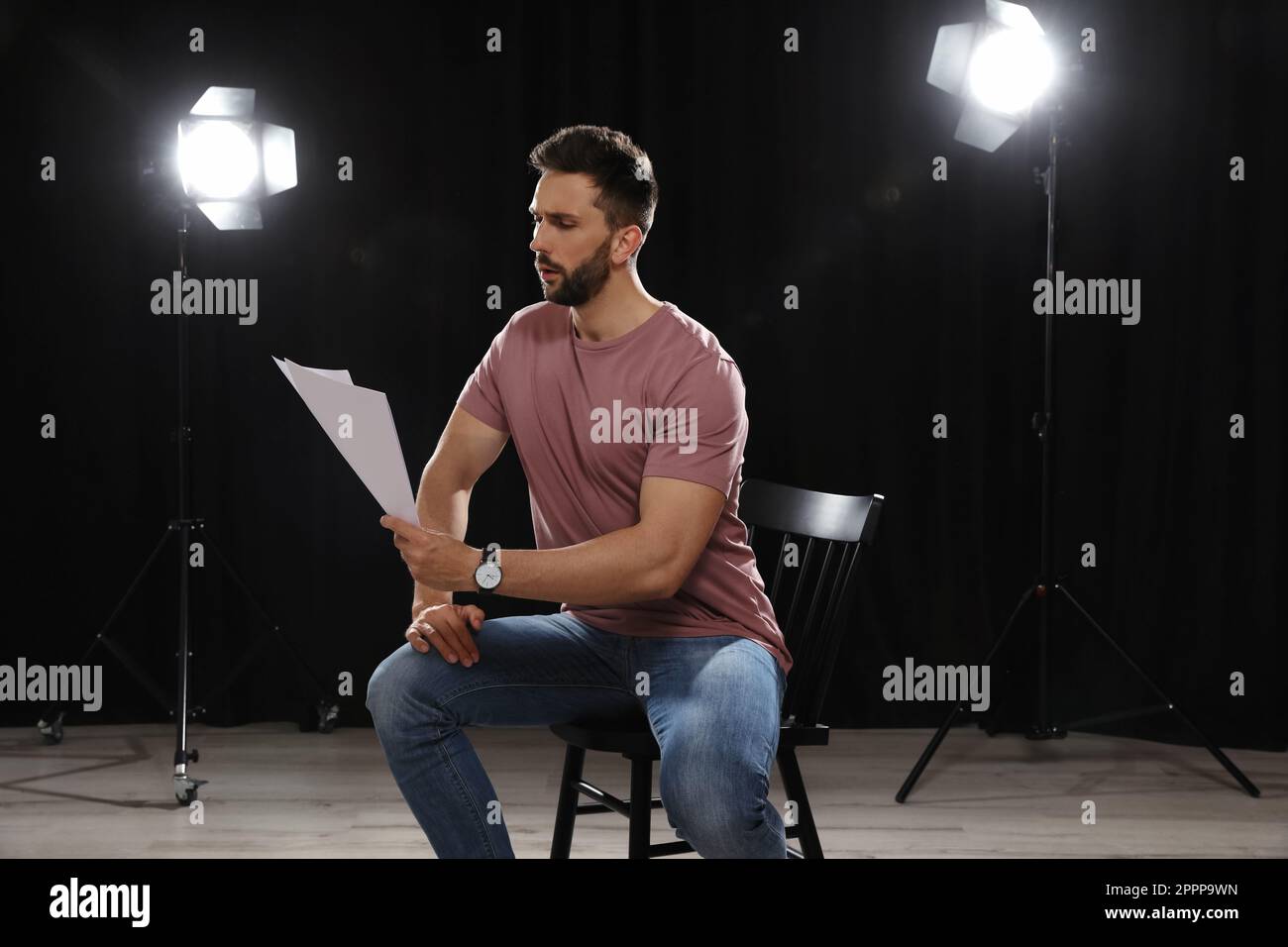 Professional actor reading his script during rehearsal in theatre Stock ...