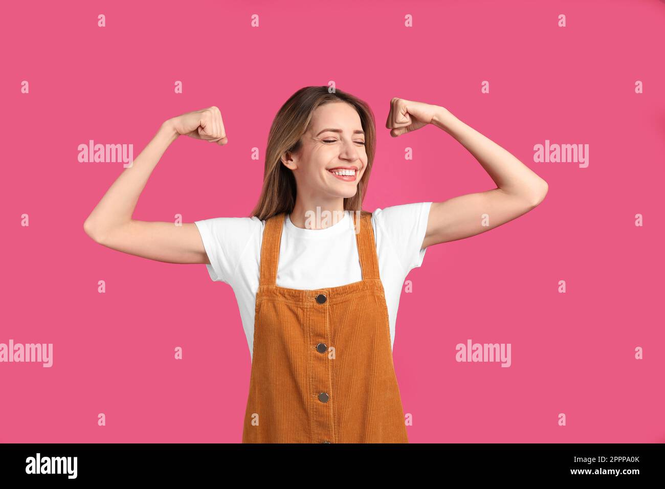 Strong woman as symbol of girl power on pink background. 8 March ...