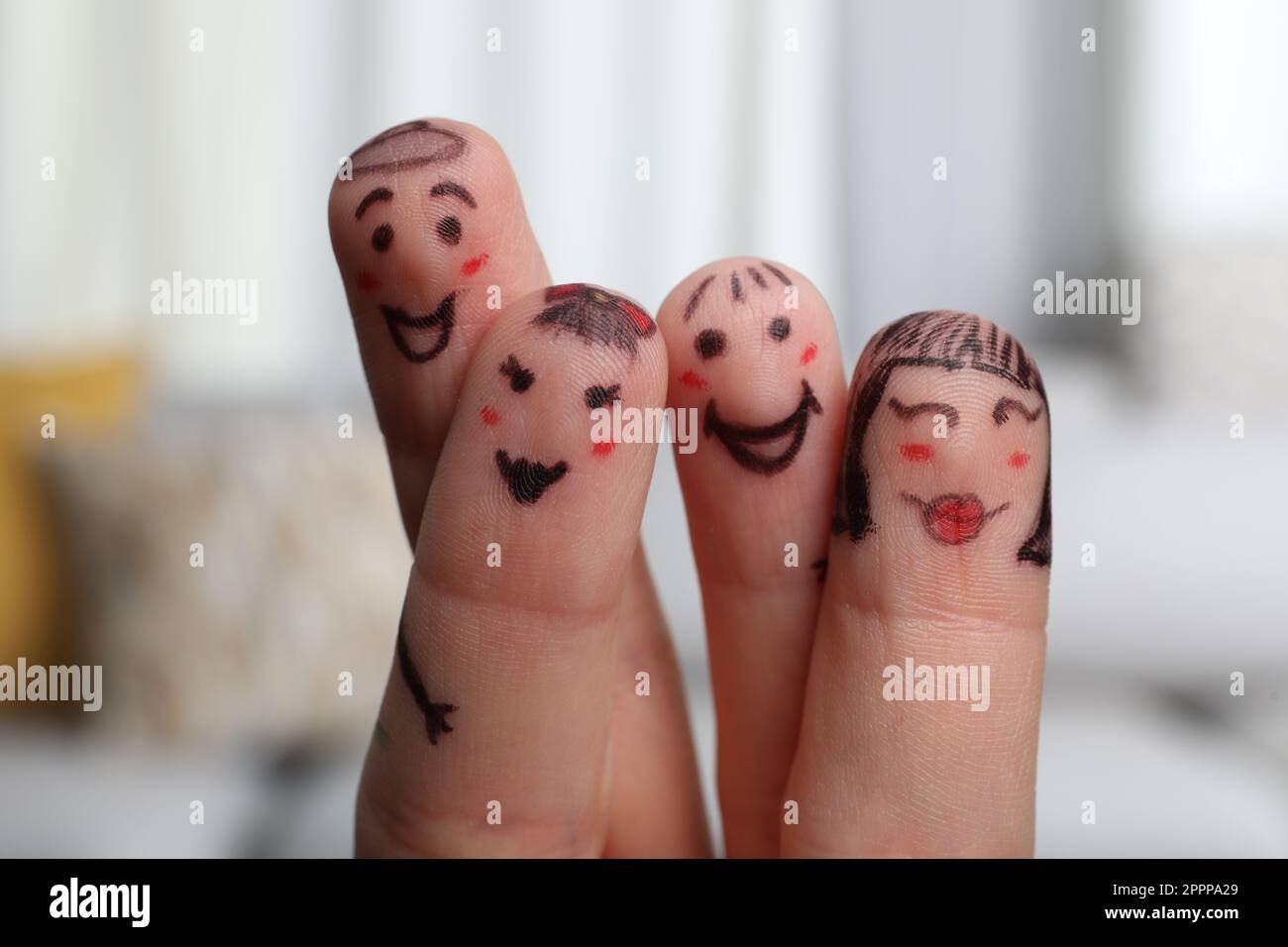 Four fingers with drawings of happy faces on blurred background Stock ...