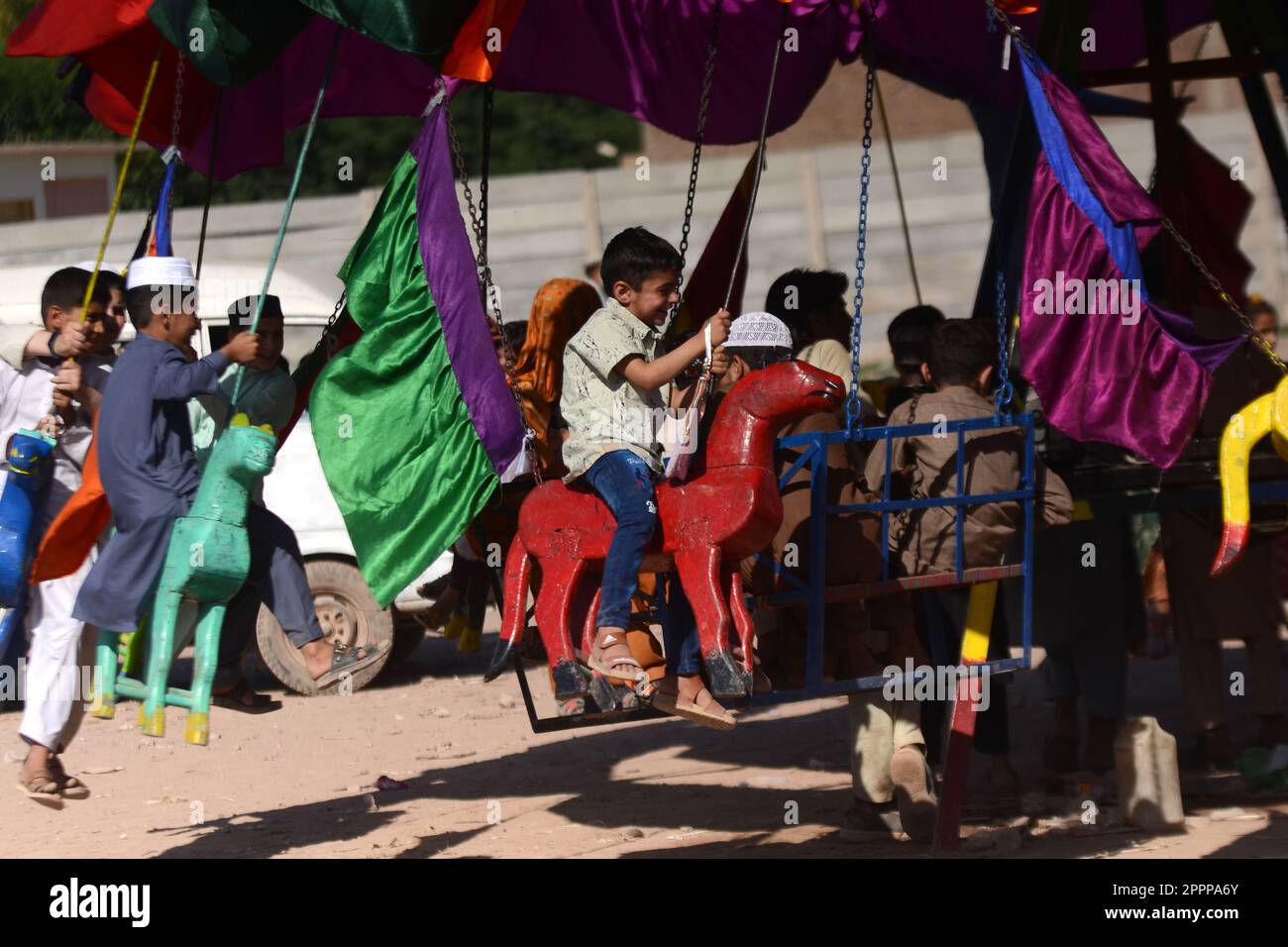 Peshawar, Khyber Pakhtunkhwa, Pakistan. 23rd Apr, 2023. Children enjoy ...