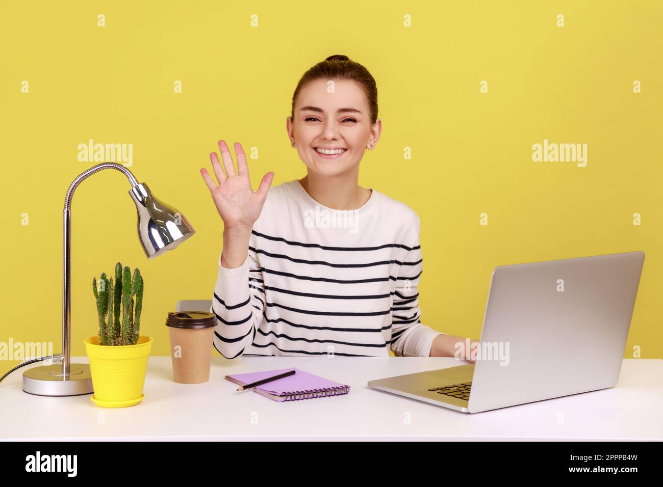 Portrait of friendly positive woman office manager waving hand to ...