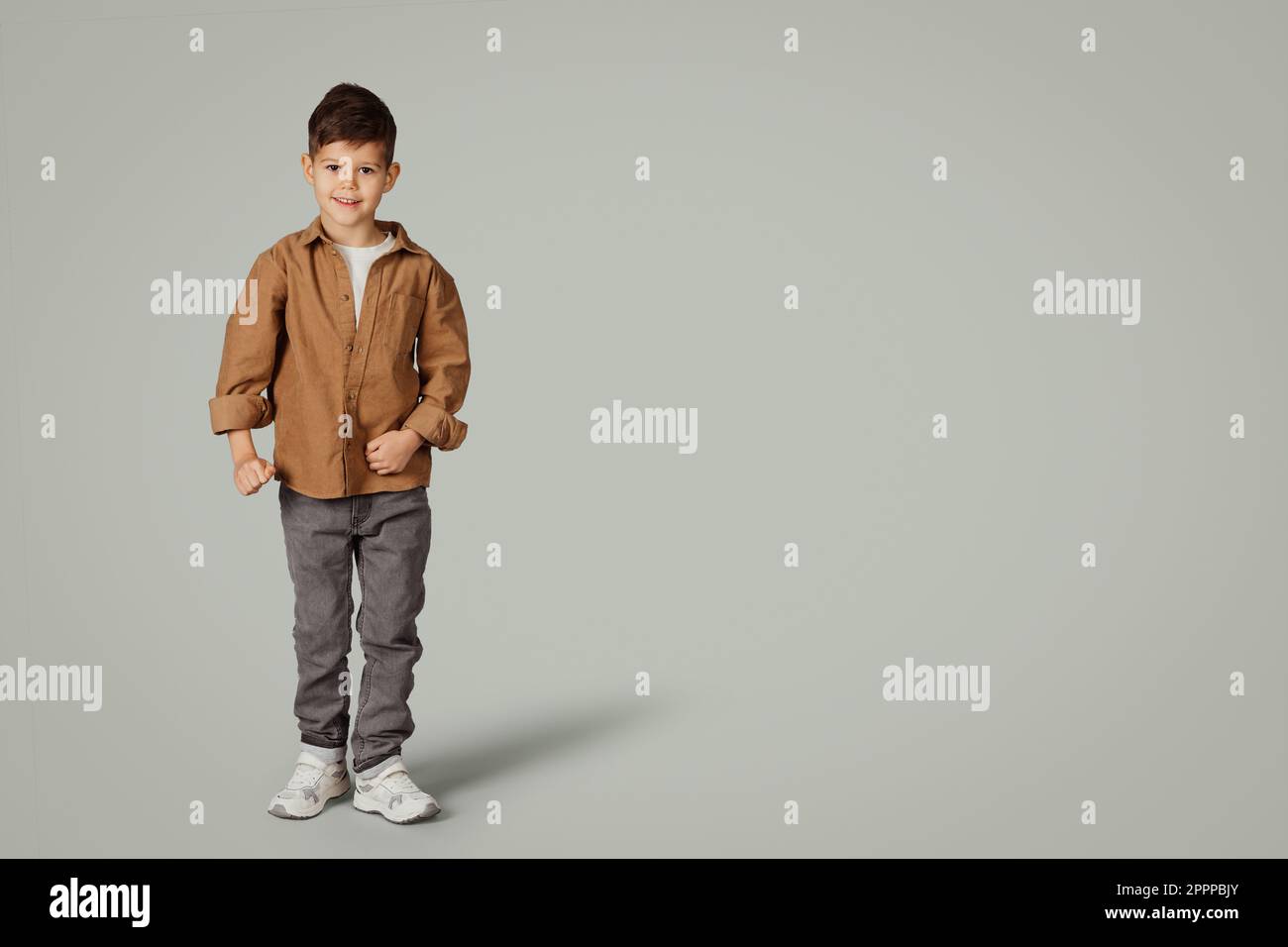 Cheerful cute little child 6 years old in casual walking with free ...