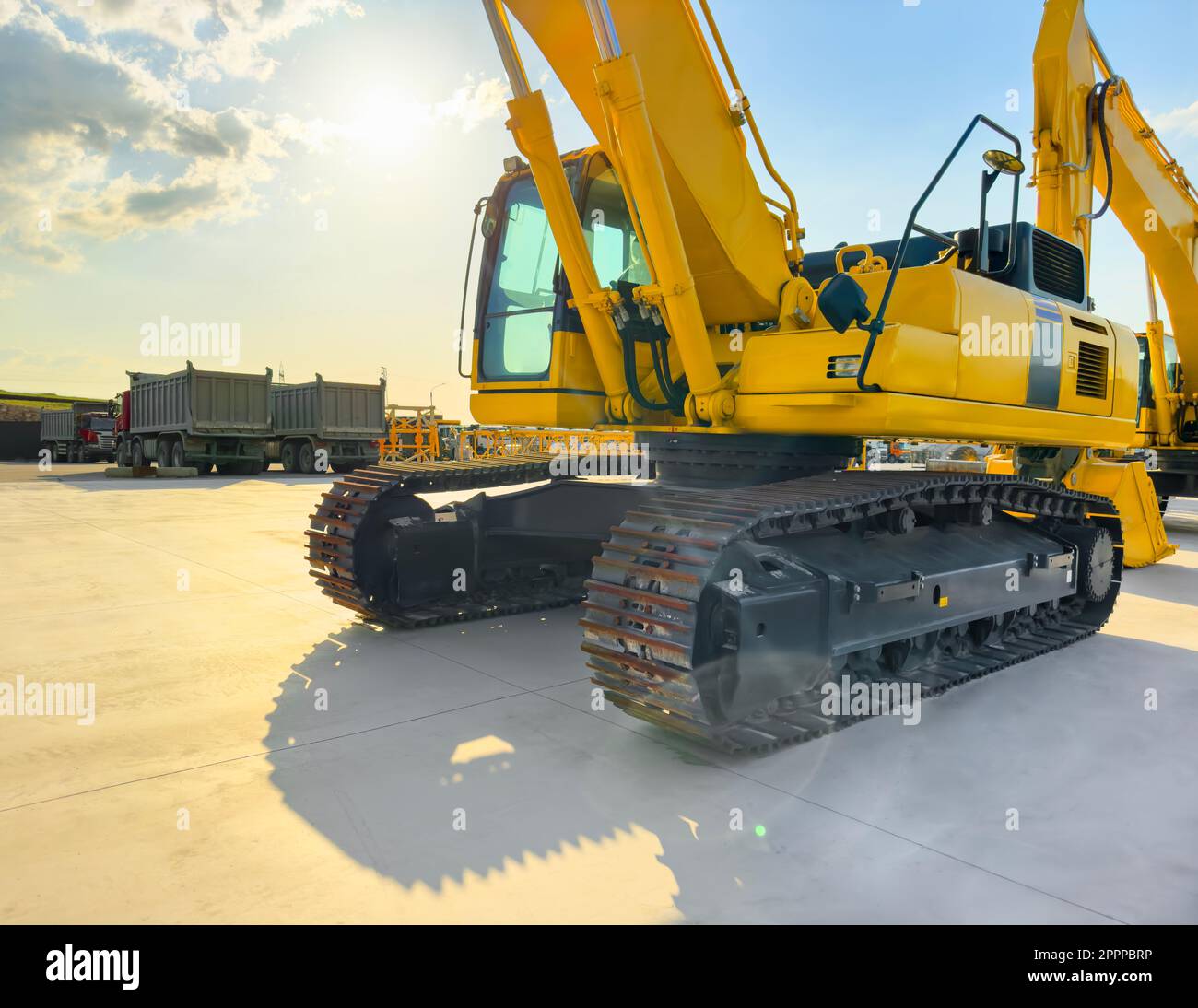 Crawler excavator with lift up bucket at construction site. Powerful ...
