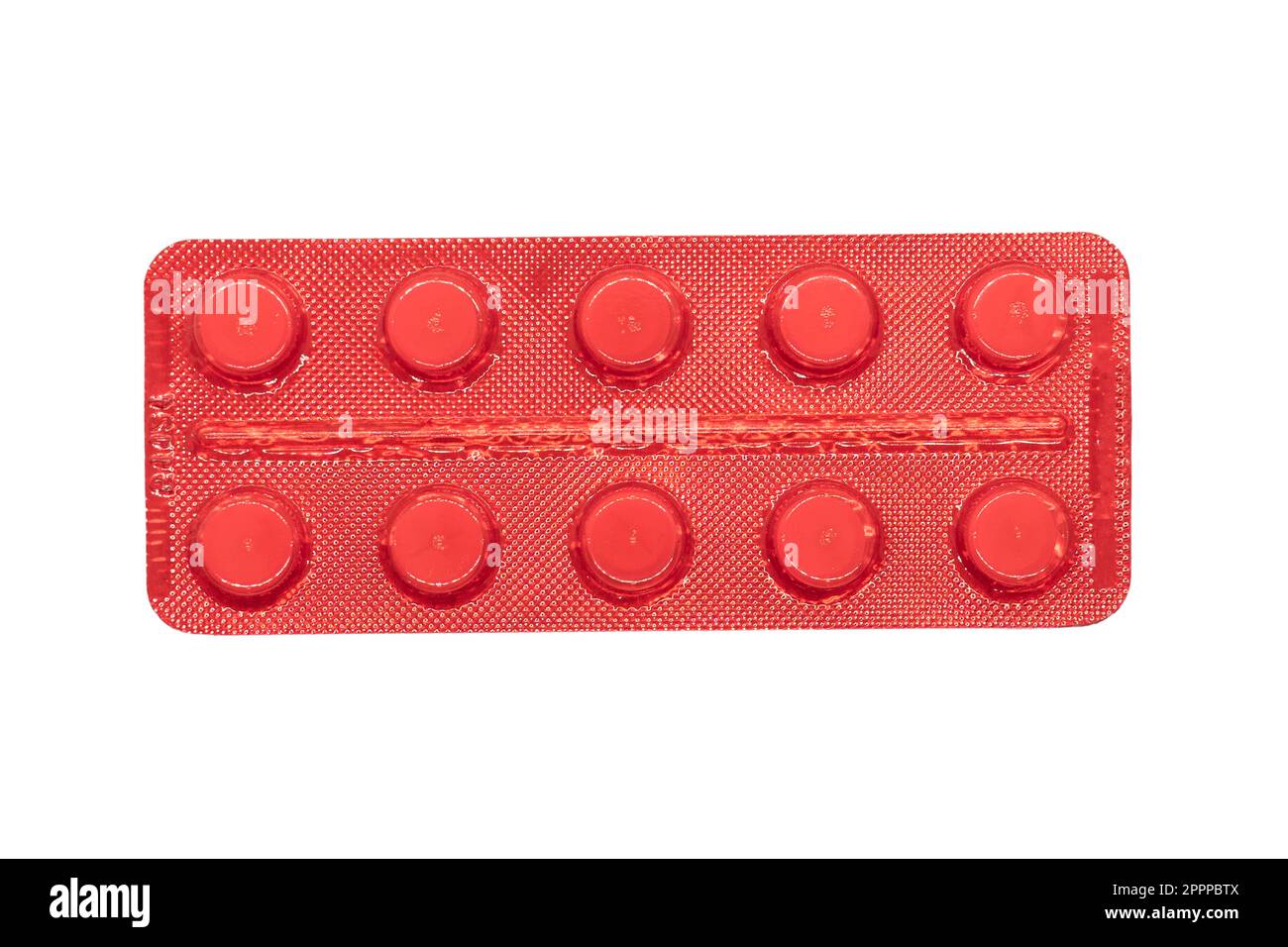 Macro shot pile of white tablets pill in red blister packaging isolated ...