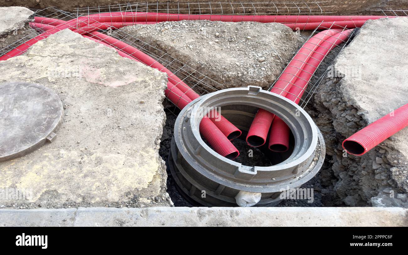 Installation of a sewage plastic pipe during the construction. Street ...