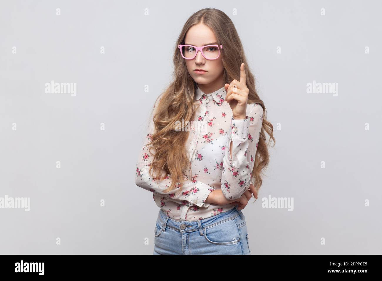 Be careful. Portrait of beautiful woman in glasses with long blond hair ...