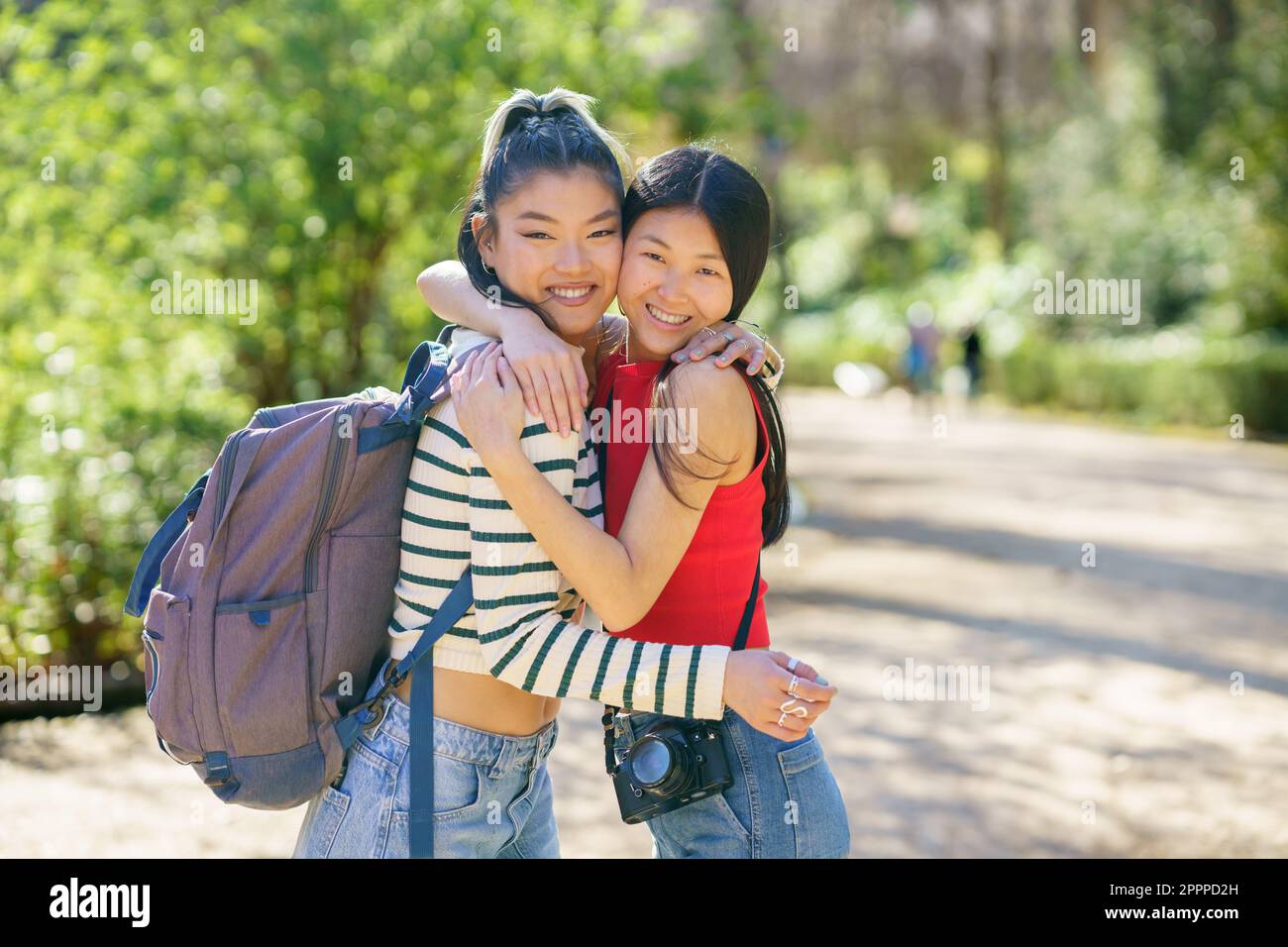 Female friends hugging summer hi-res stock photography and images - Alamy