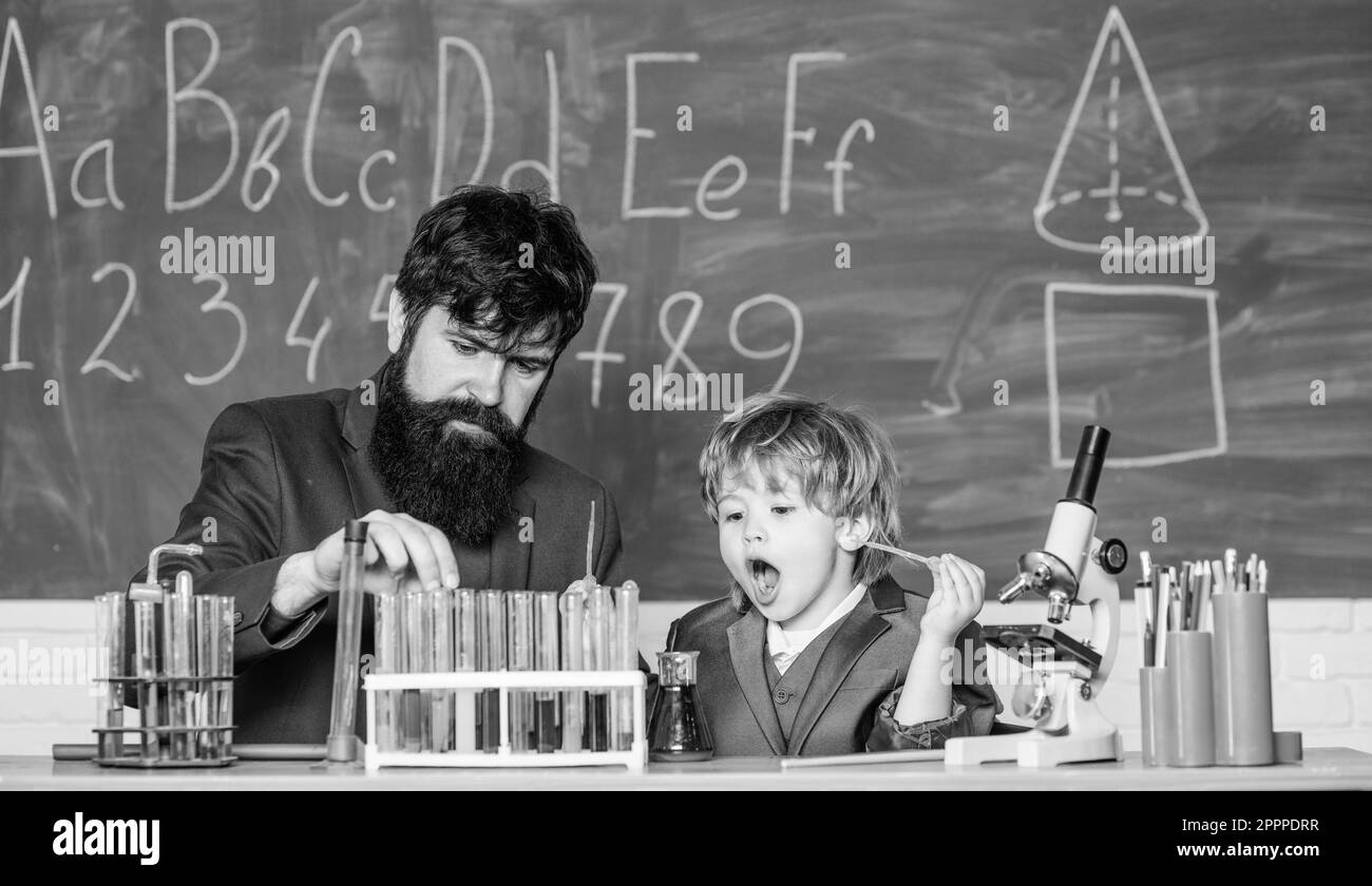 laboratory research and development. father and son at school. science ...