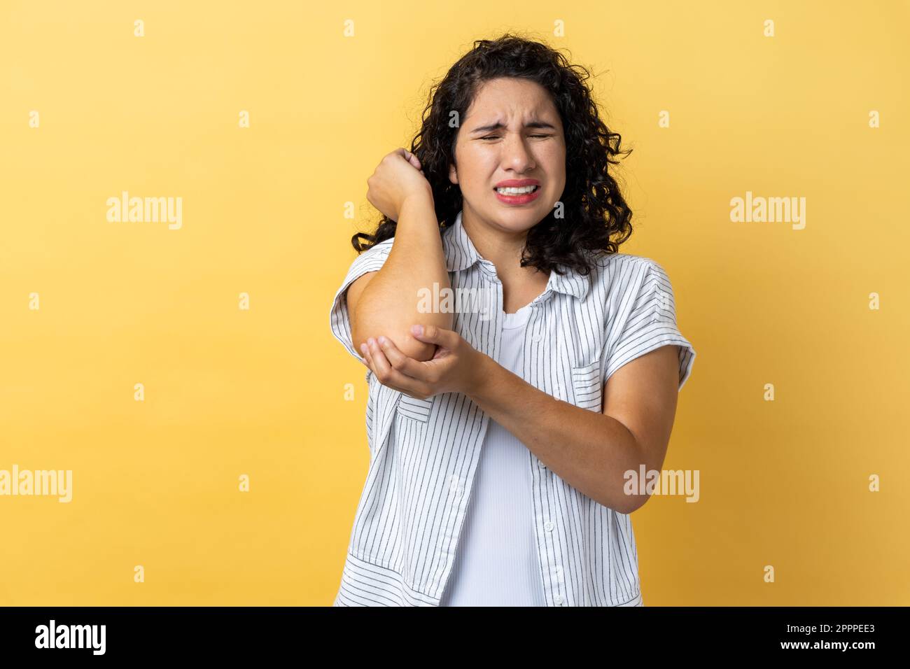 Portrait of woman with dark wavy hair having trauma after car accident ...