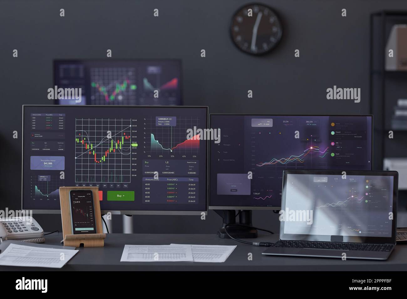 Horizontal image of workplace of brokers with computer monitors with ...