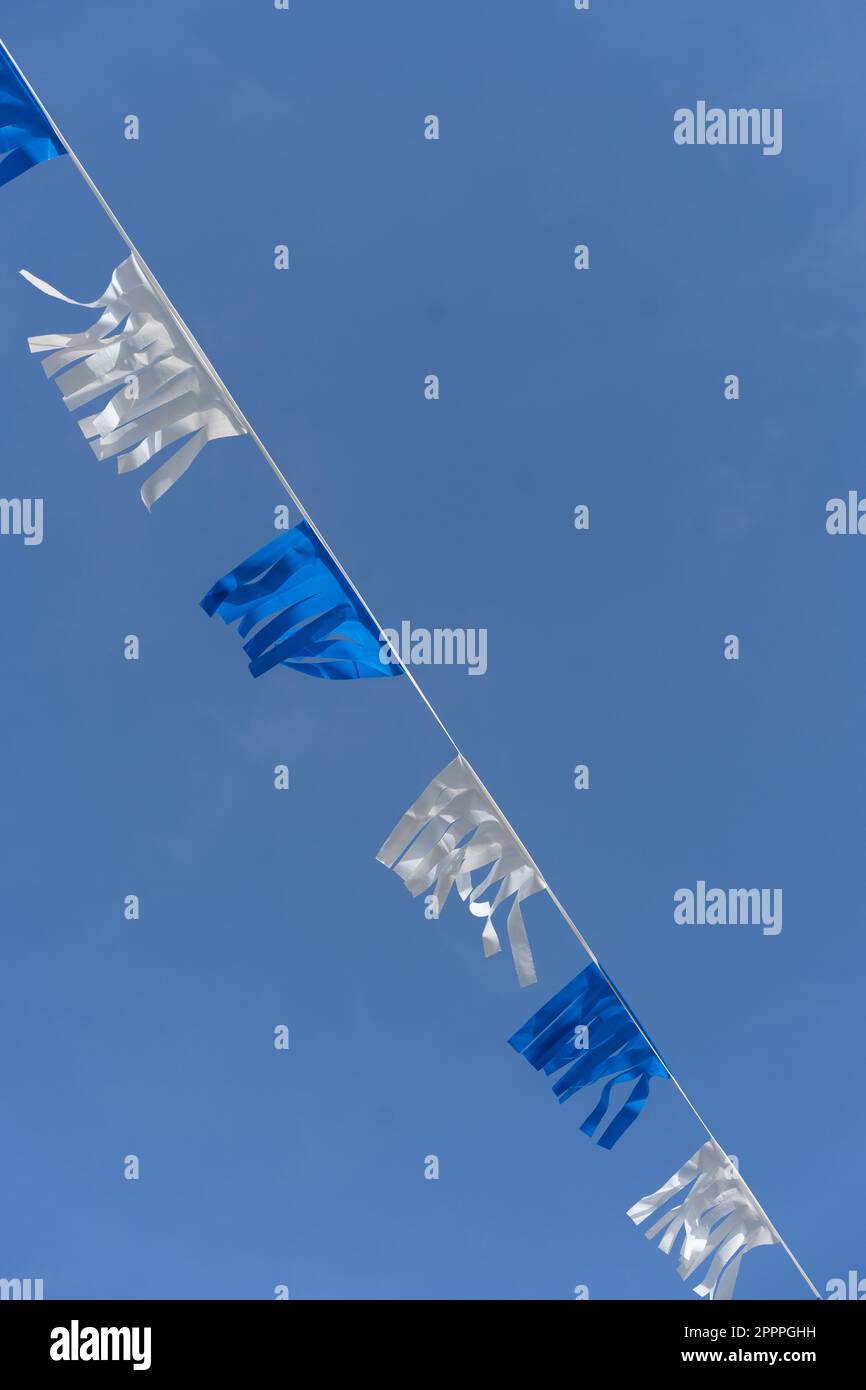 Israeli blue and white flag bunting fluttering against a backdrop of ...
