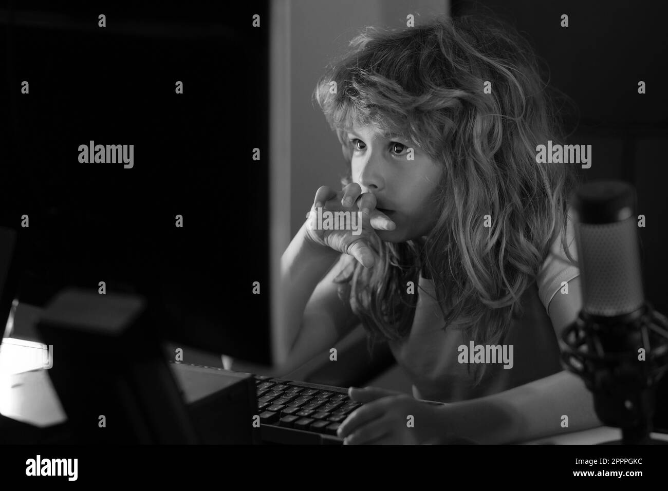 Child playing computer games or studying on pc computer. Kid gamer on ...