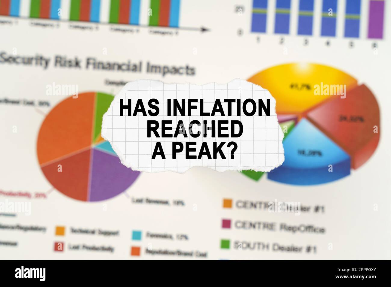 Business concept. On diagrams and graphs lies torn paper with the ...