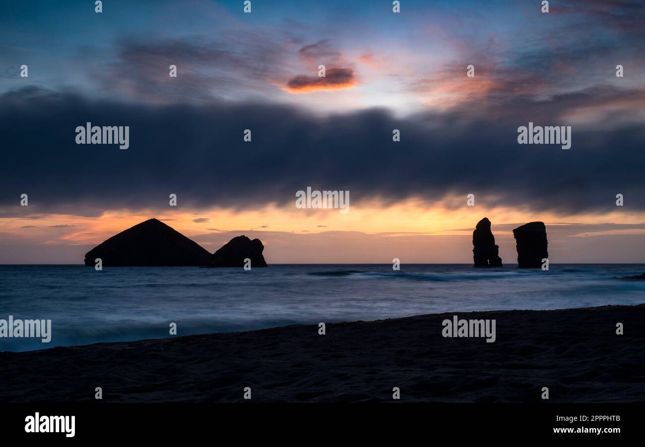 Sunset with black sand in mosteiros, sao miguel azores Stock Photo - Alamy