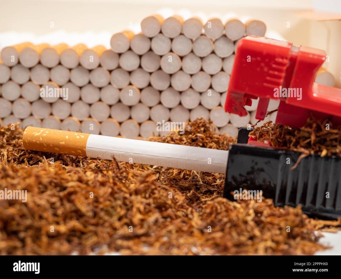 Tobacco and filling machine. Cigarettes and tobacco. Tobacco close-up ...