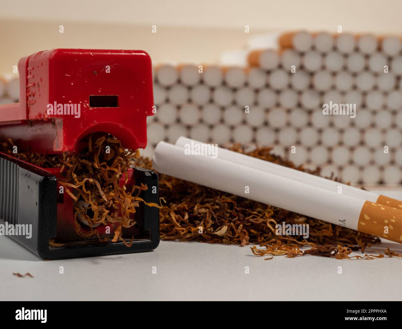 Tobacco and filling machine. Cigarettes and tobacco. Tobacco close-up ...