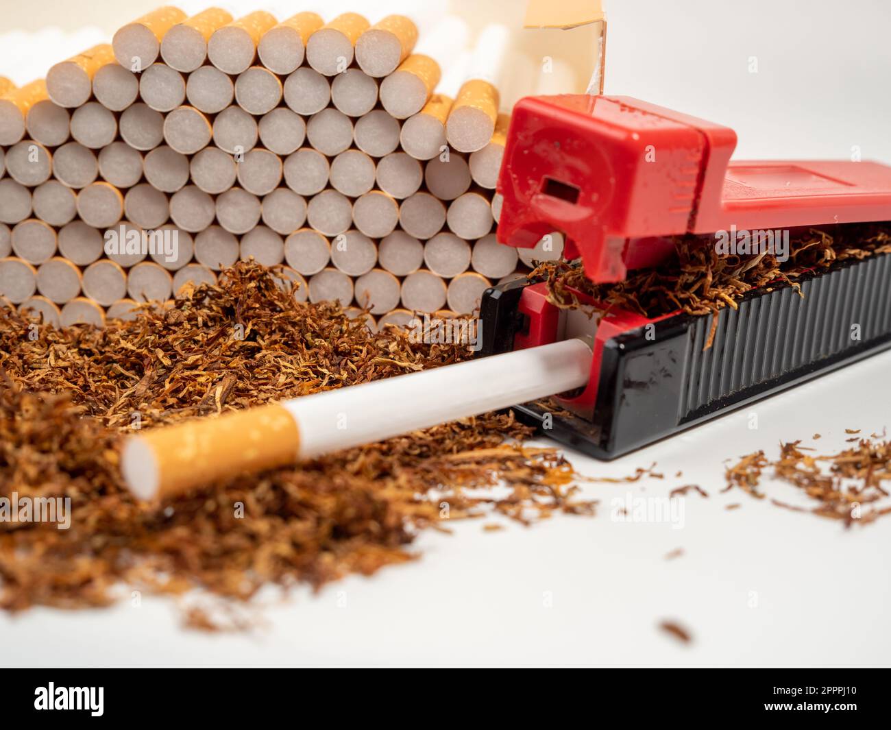 Tobacco and filling machine. Cigarettes and tobacco. Tobacco close-up ...