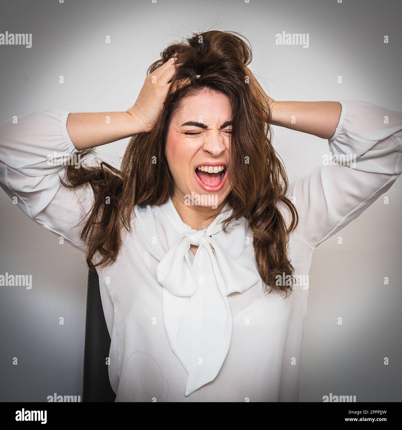 Scene of anger and hysterism of a young teacher who has a nervous ...