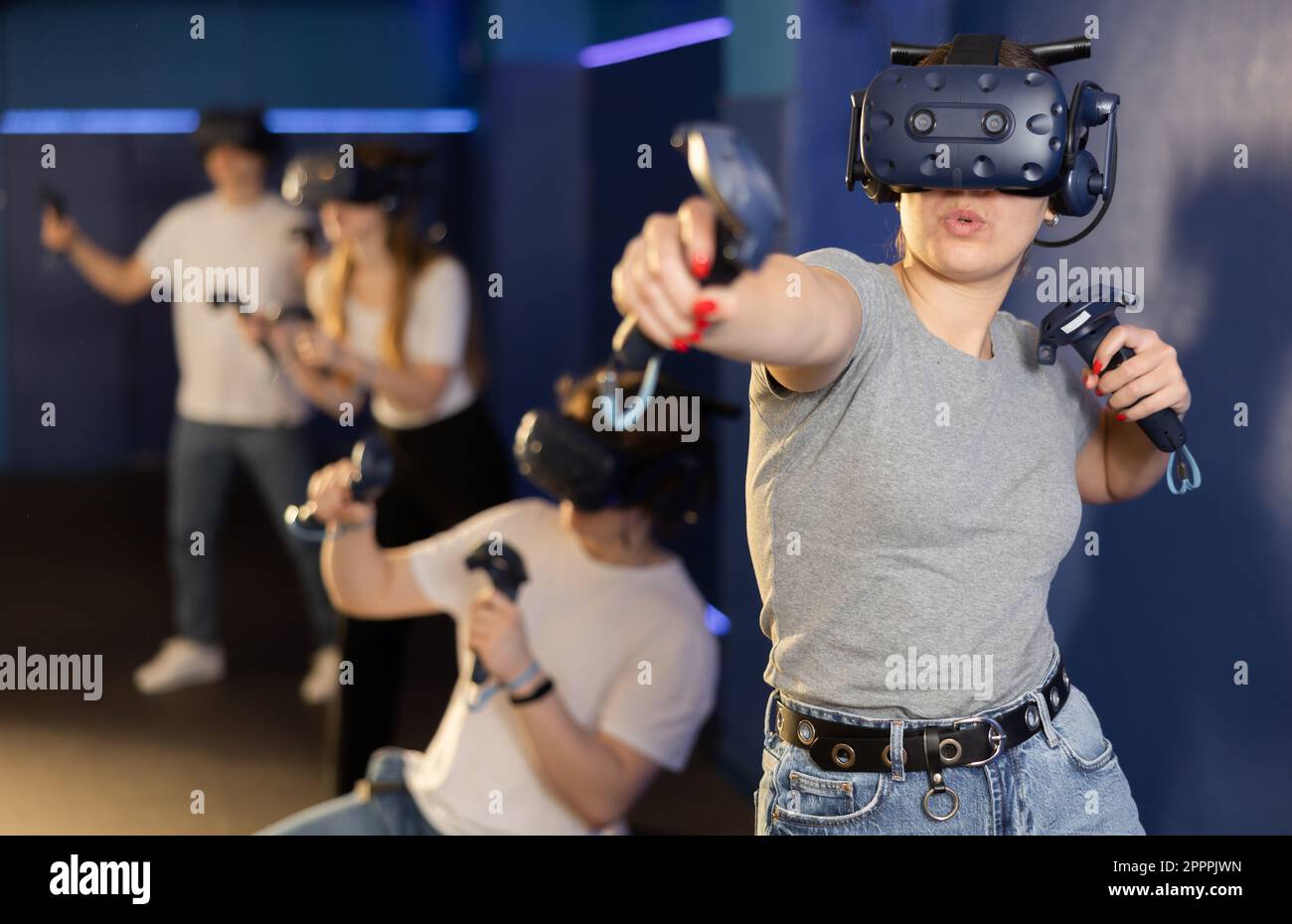 teenager in virtual reality glasses with joystick play survival game in ...