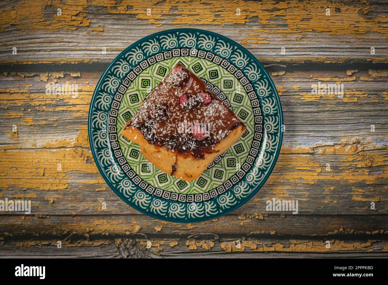 Marijuana cake with dry red currants and chocolate on arabic color ...