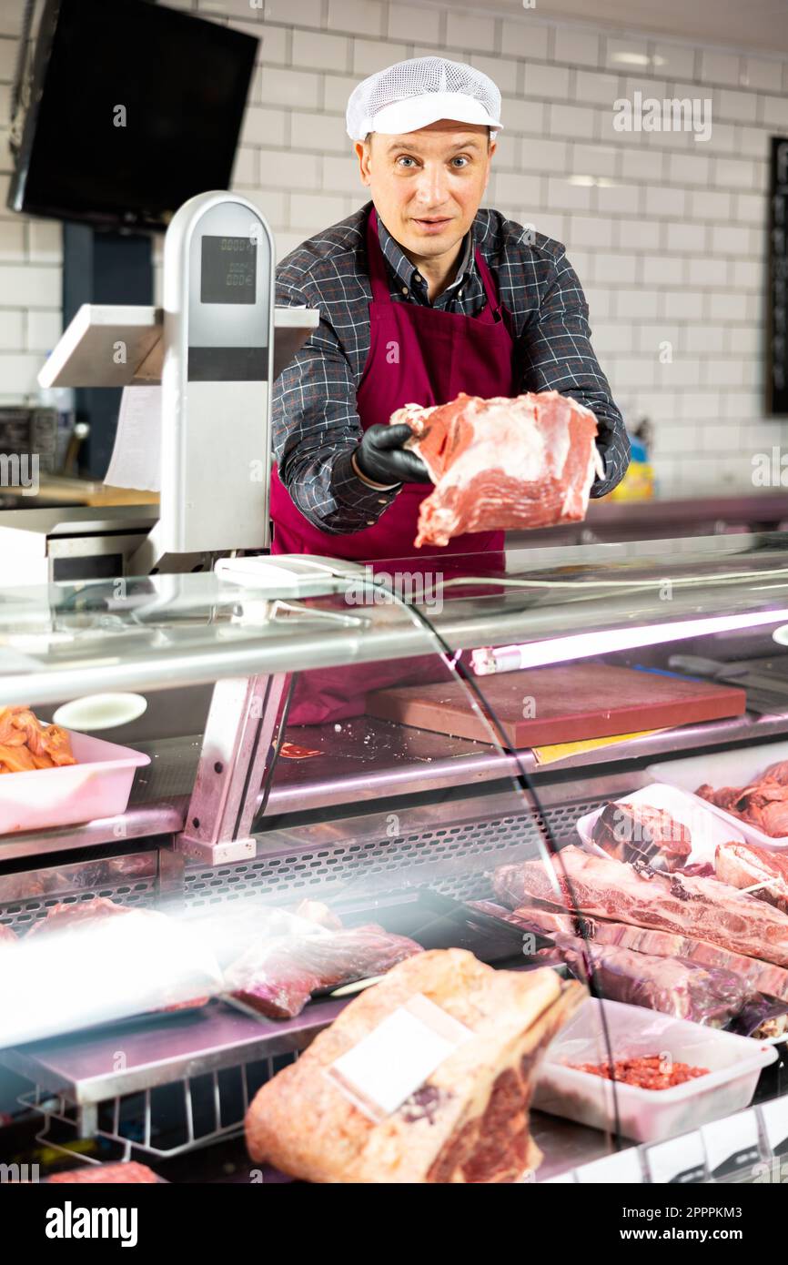 Adult man puts meat hi-res stock photography and images - Alamy