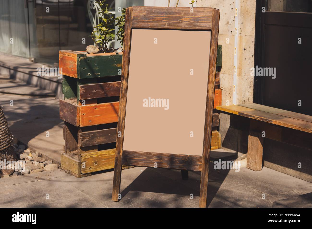Blackboard in front of restaurant entrance. Mock up menu blank board ...
