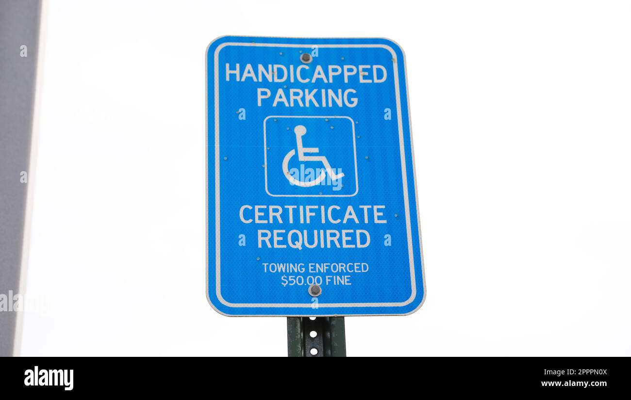 The blue handicap sign on the street - a universal symbol for ...