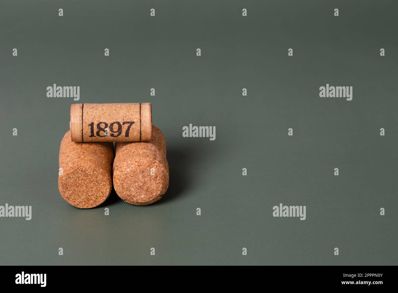 A man's hand holds cut corks and cuts them. Preservation of the planet ...