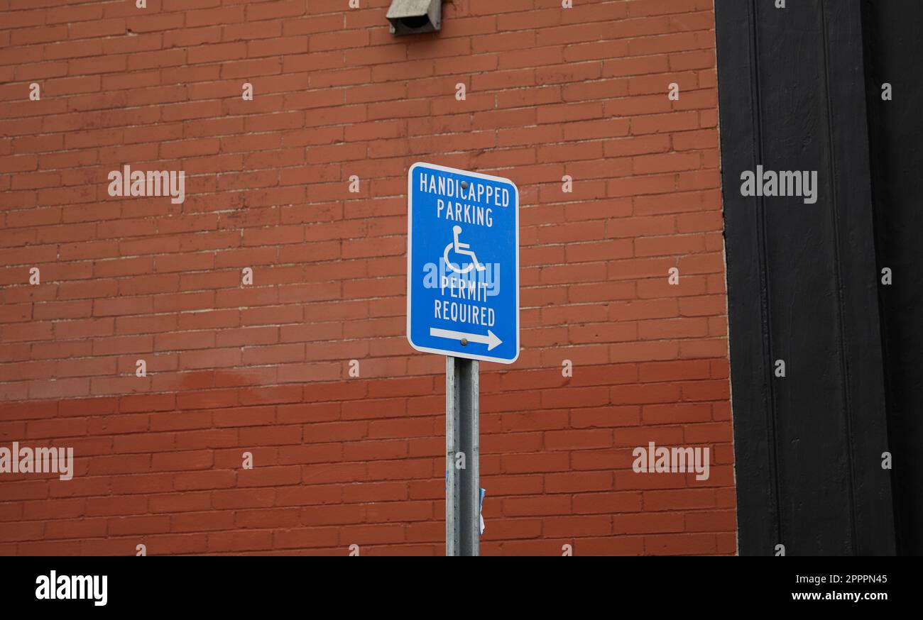 The blue handicap sign on the street - a universal symbol for ...