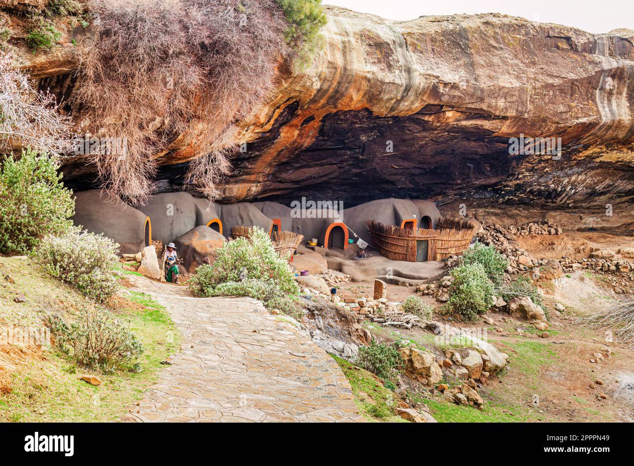 MATEKA, LESOTHO - AUGUST 23, 2012: Indigenous woman in front of the ...