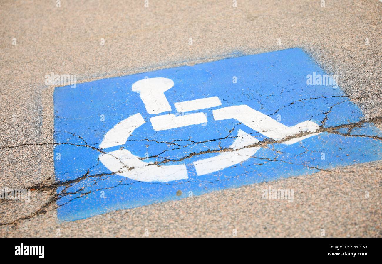 The blue handicap sign on the street - a universal symbol for ...
