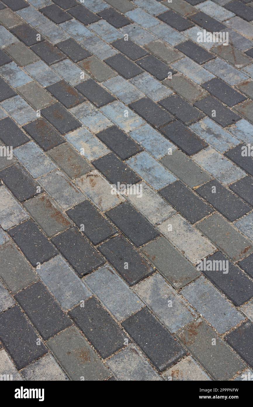 Background in the form of motley gray concrete tiles of a rectangular ...