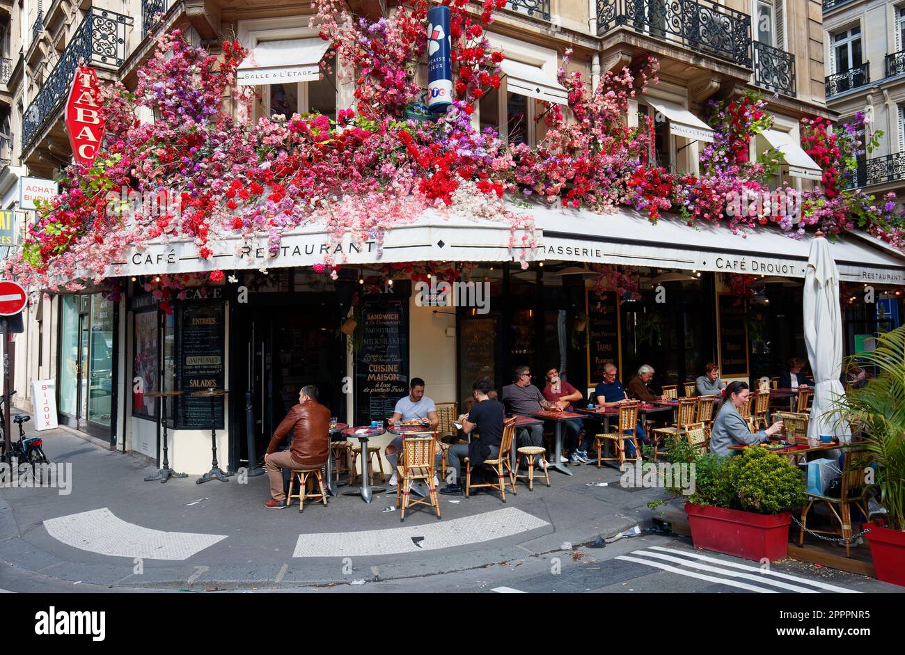 The traditional French restarant Drouot decorated with flowers . It ...
