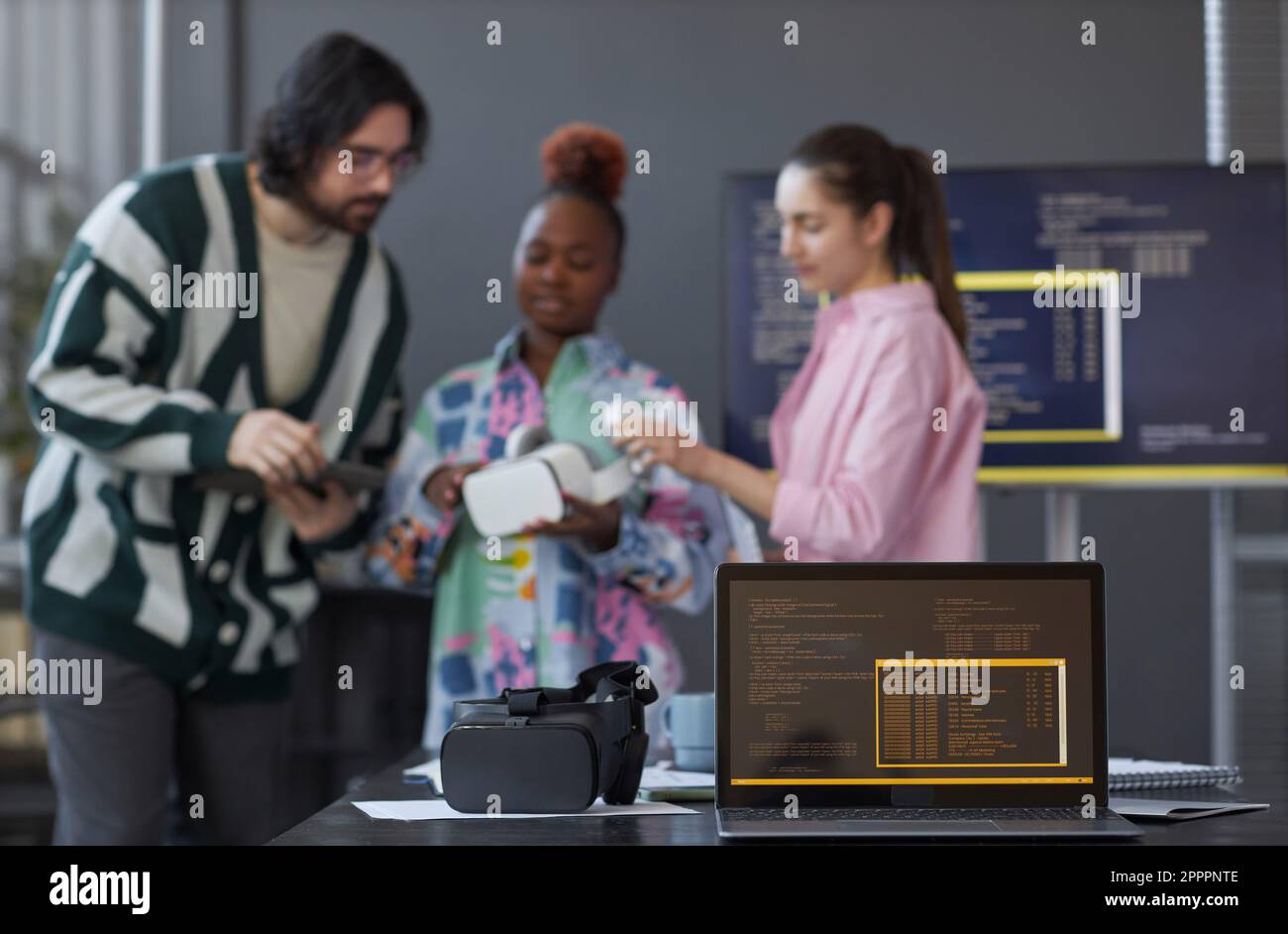 Team of young programmers testing new software of VR glasses during ...