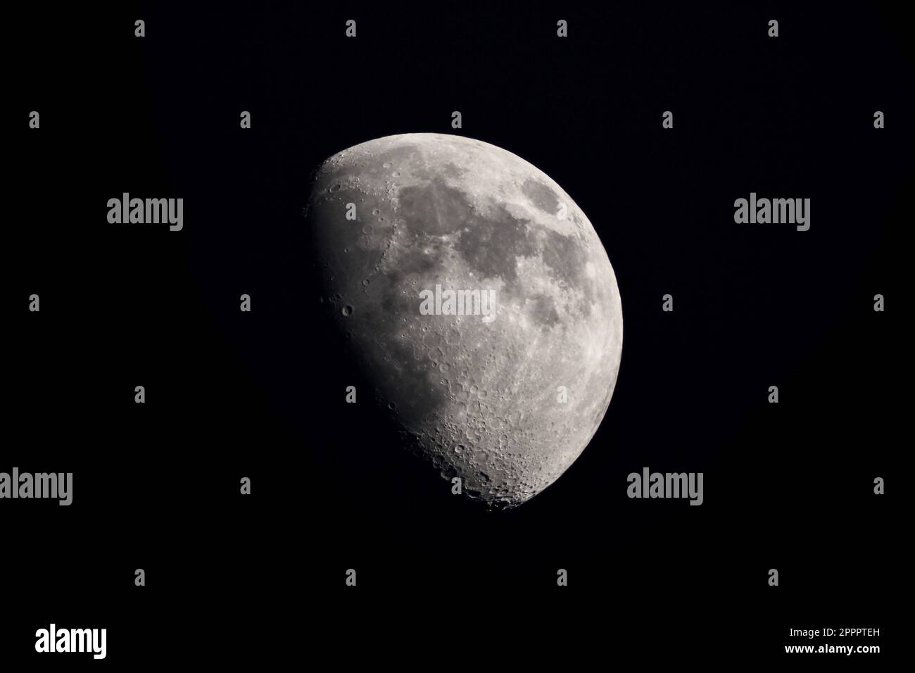 Half moon viewed from a telescope Stock Photo - Alamy