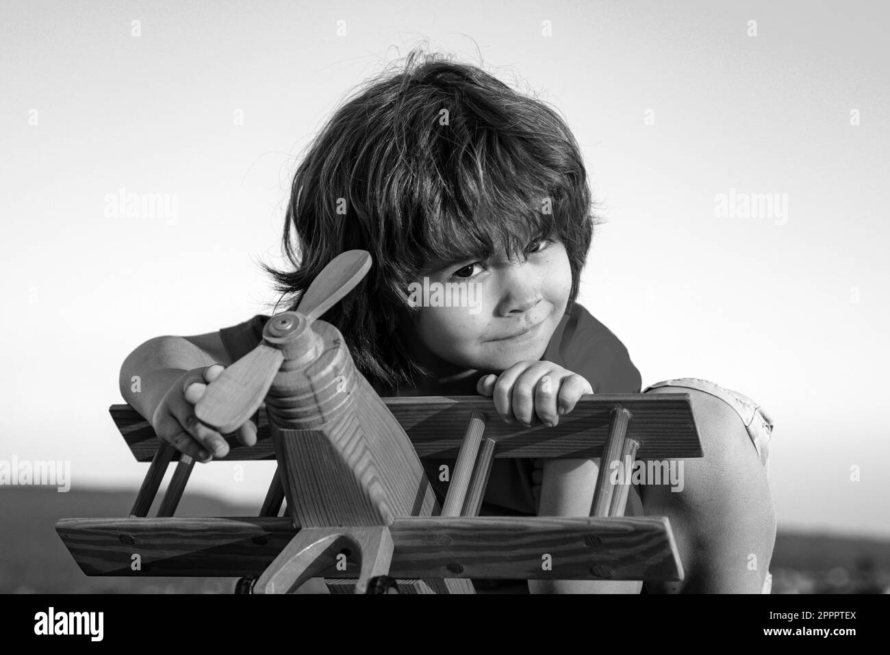 Funny child or kid little boy pilot play with toy airplane, startup ...