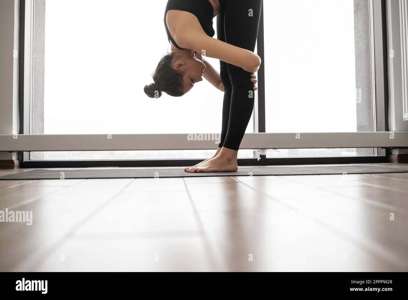 Position yoga knees standing hi-res stock photography and images - Alamy