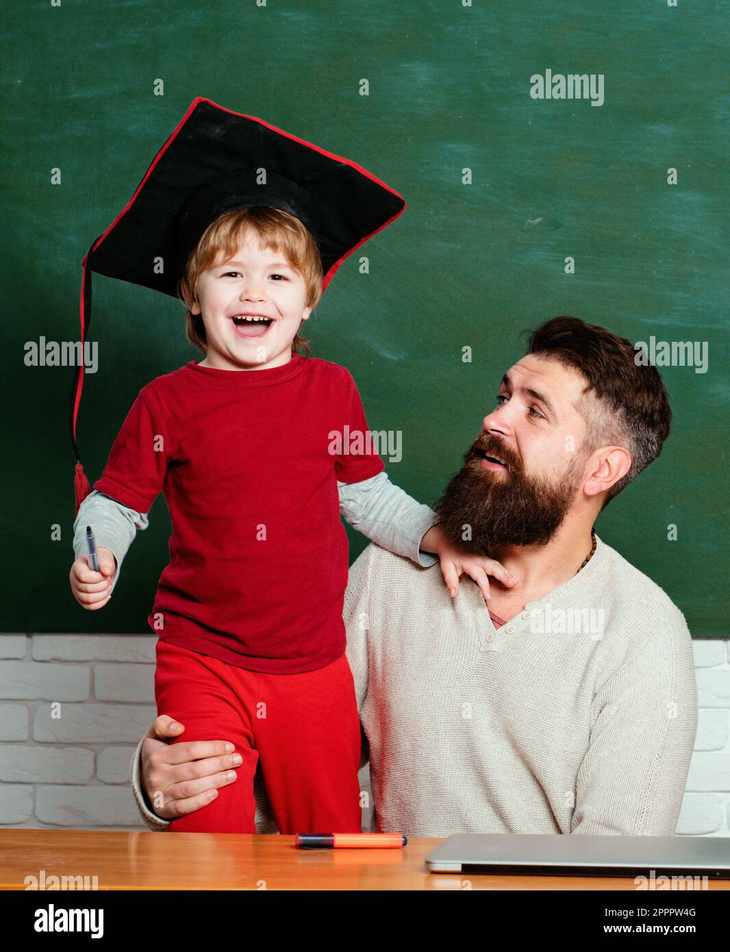 Man teacher play with preschooler child. Being joyful and thrilled ...