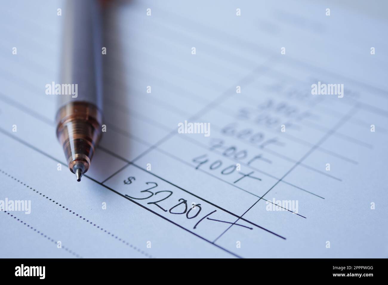 A man writes payment due in a paper form Stock Photo - Alamy