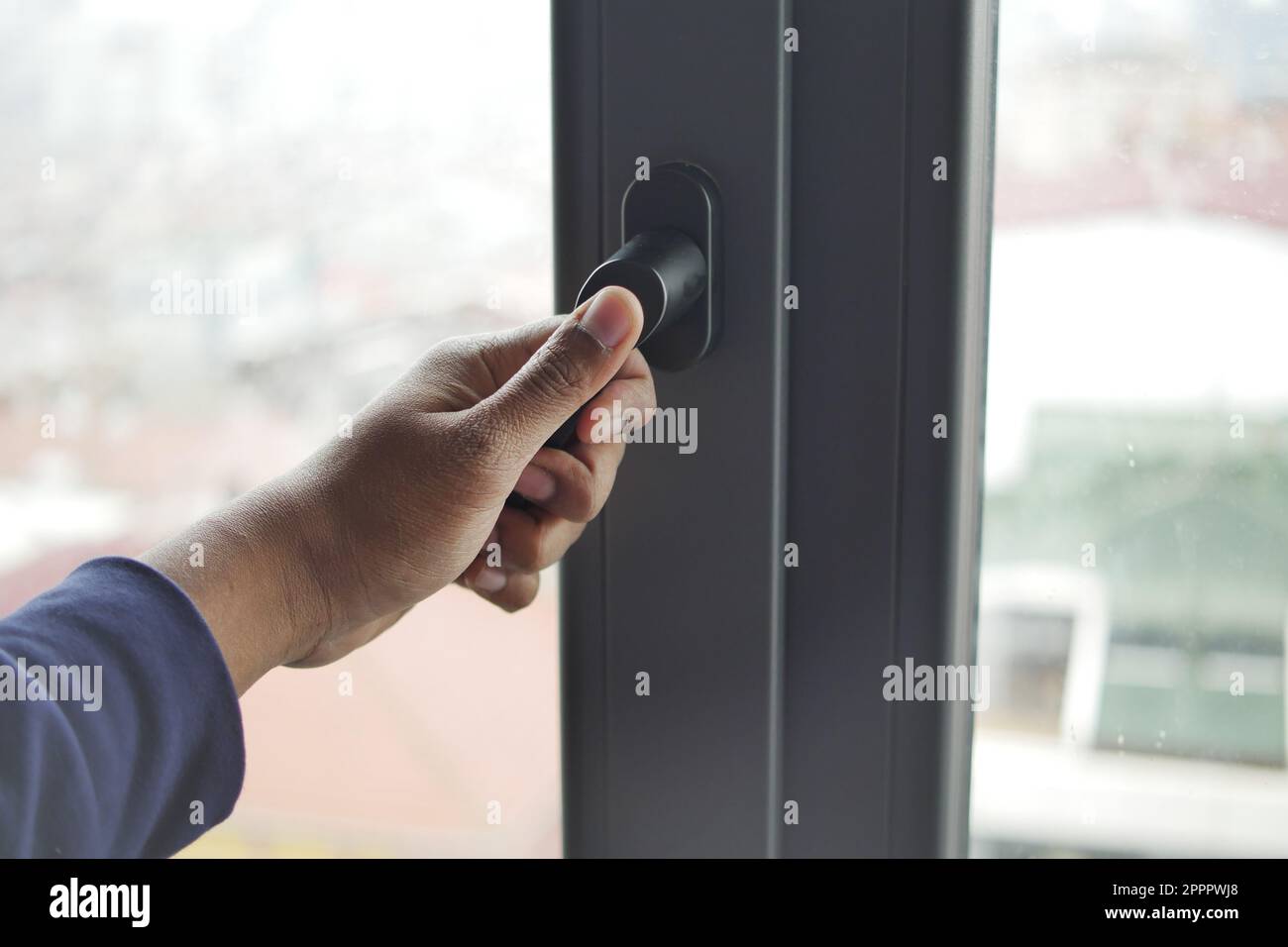 hand holding door or window handle Stock Photo - Alamy