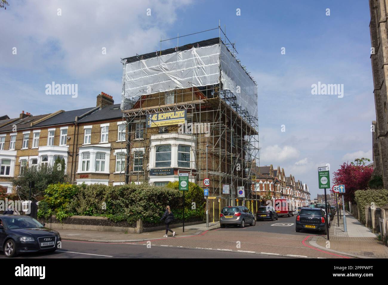 A large house with the entire roof covered in scaffolding to enable ...
