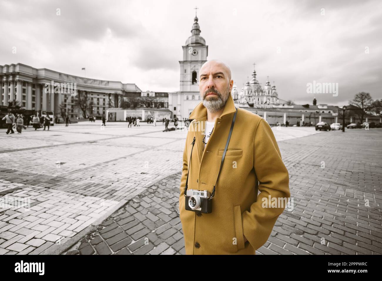 Handsome beard photographer makes pictures on film retro camera in the ...