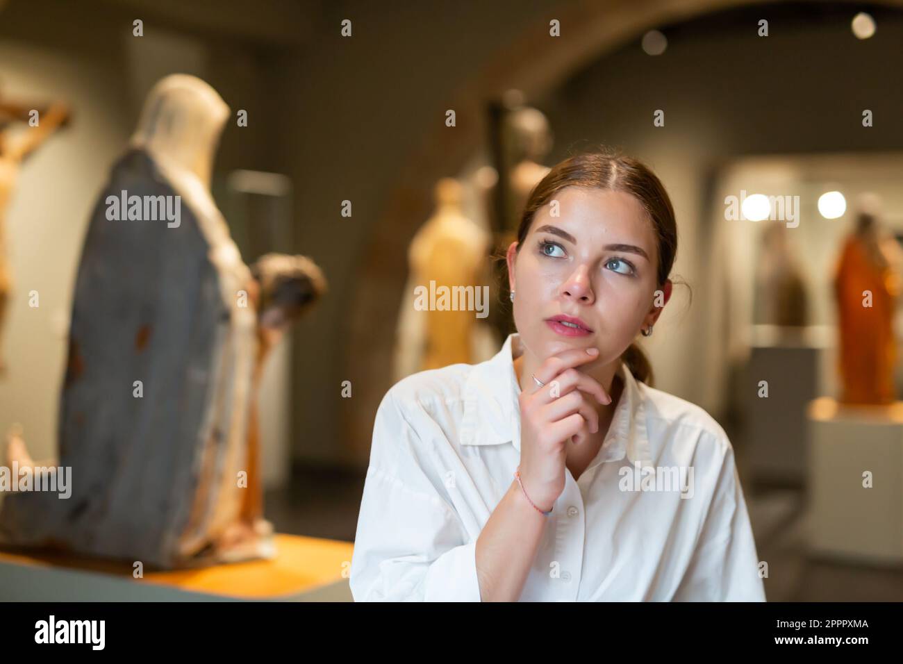 Positive woman in hall of historical museum Stock Photo - Alamy